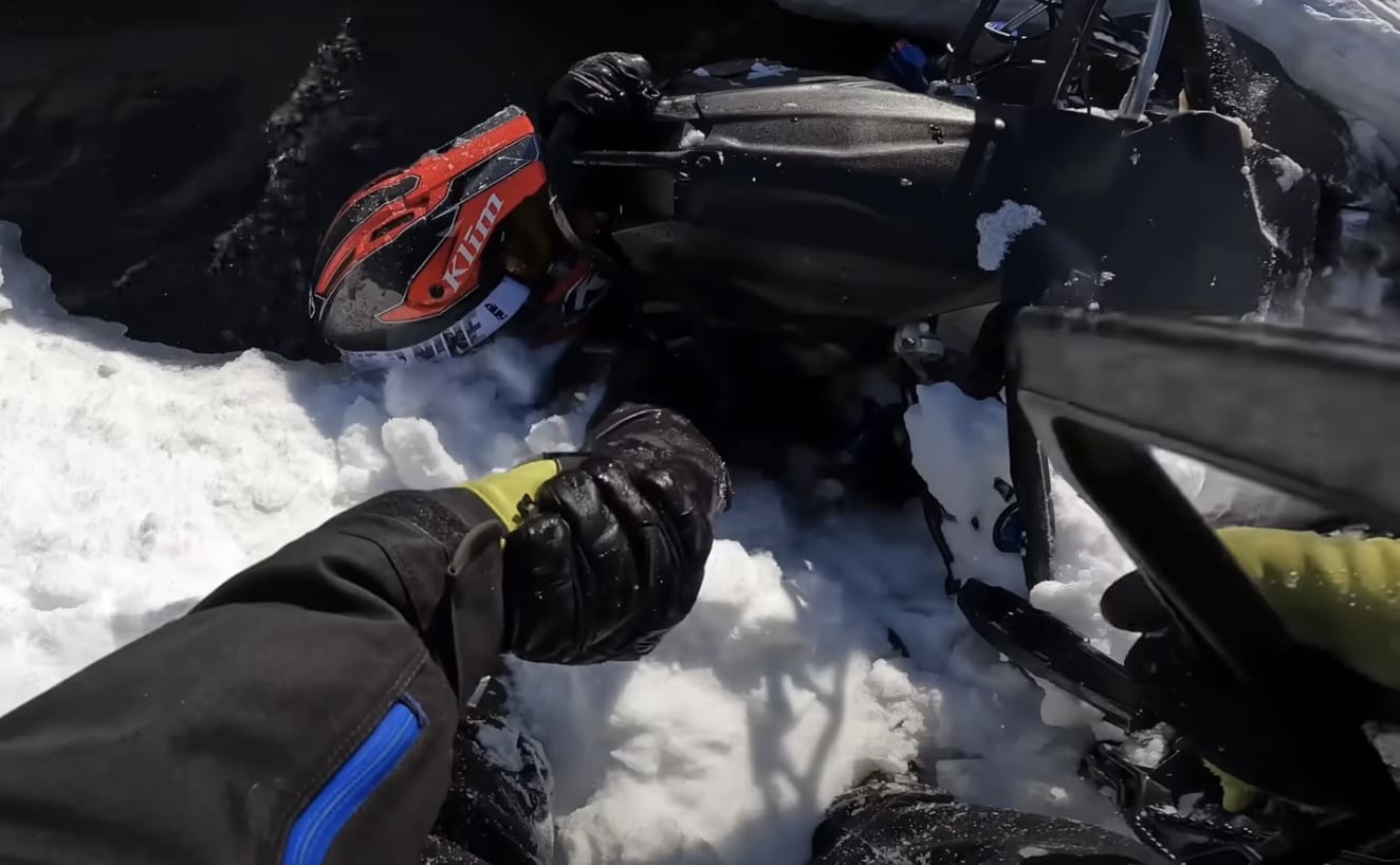 Snowmobiler Rescued After Breaking Through Frozen River & Nearly Swept ...