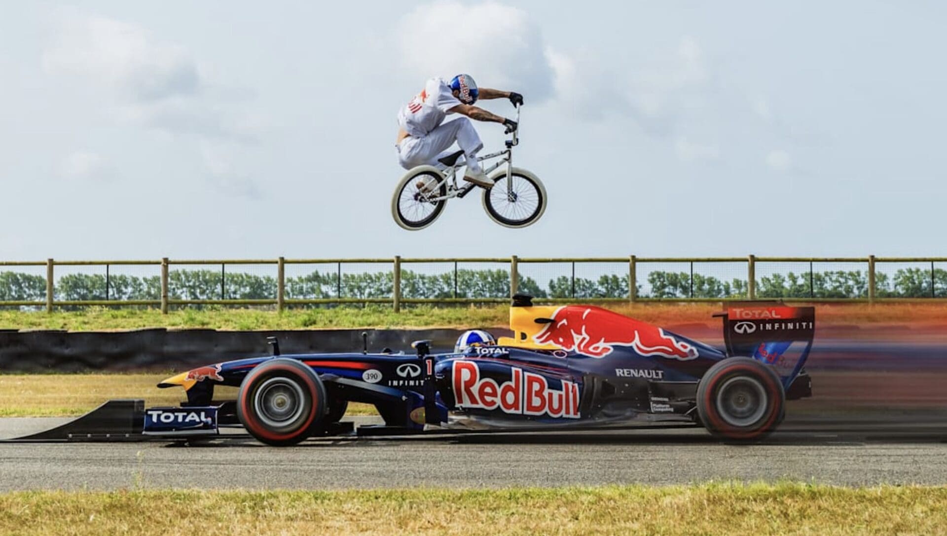 World First BMX Jump Over A Moving F1 Car - Unofficial Networks